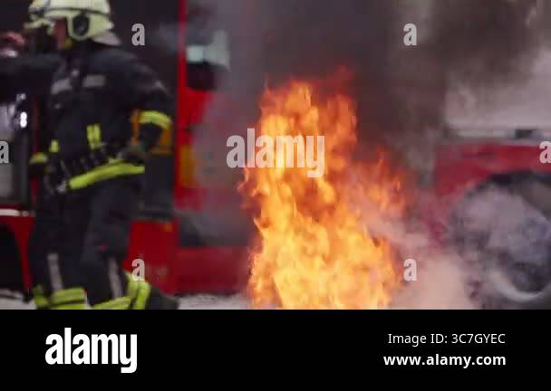 Firefighters fight the fire flame to control fire not to spreading out ...