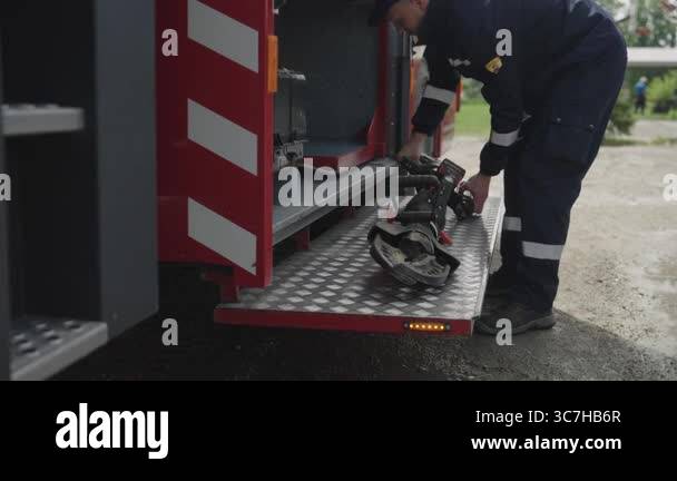 A professional firefighter meticulously prepares dangerous metal ...