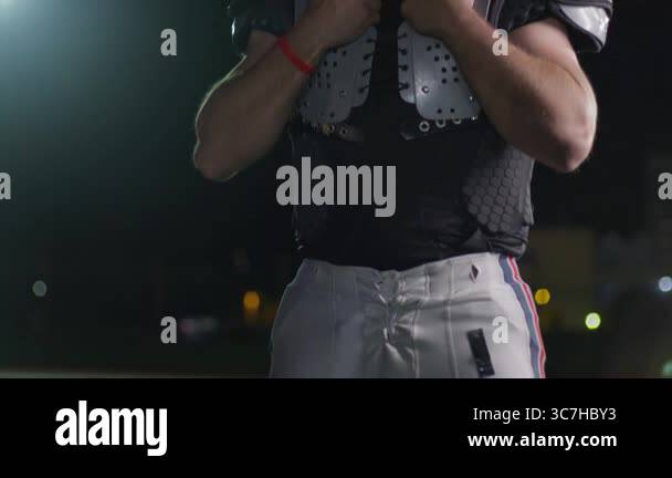 Close-up portrait of an American football player sweating after an ...