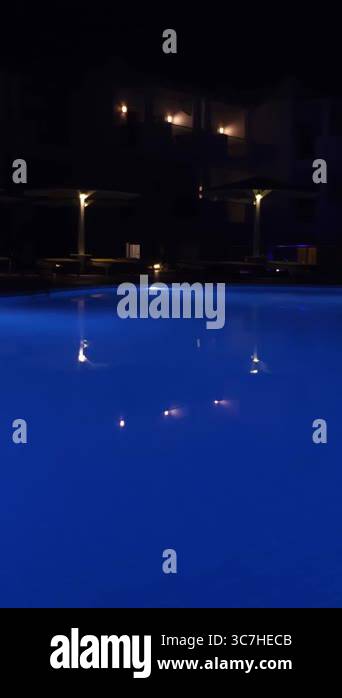 Swimming pool at night. pool water, blue backlit, at night Stock Video ...