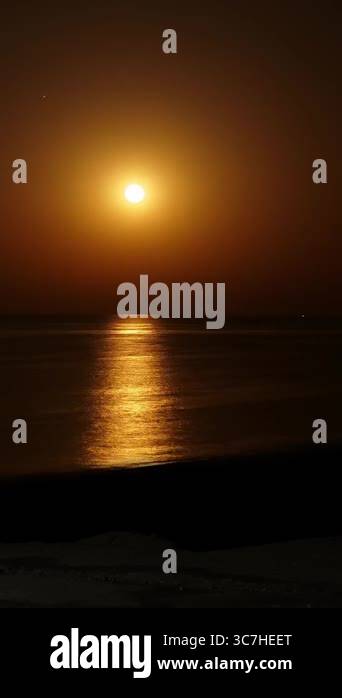 Time-lapse. moon path. night. the moon rises over the sea Stock Video ...
