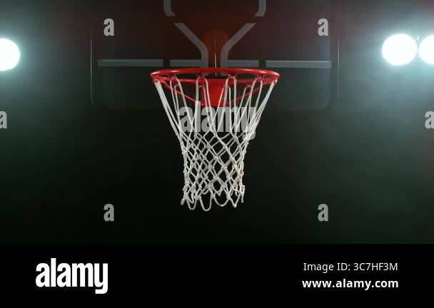 Super slow motion of basketball ball hitting the basket . Filmed on ...