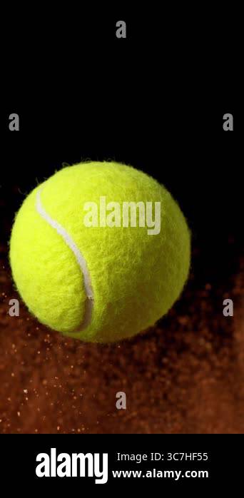 Super Slow Motion Detail Shot of Tennis Ball with Clay Explosion ...