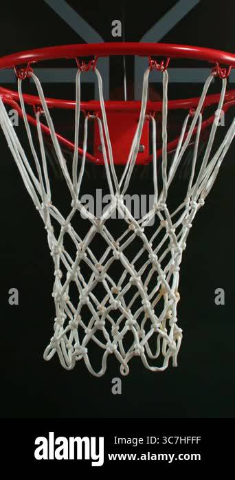 Super slow motion of basketball ball hitting the basket . Filmed on ...