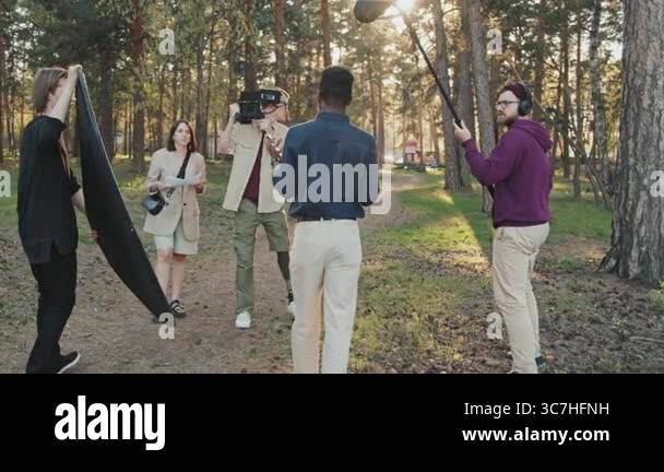 Full-shot slowmo of cameraman with leg prosthesis shooting video ...