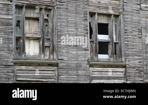 Desolate structure showcases weathered wood and shattered windows Stock ...