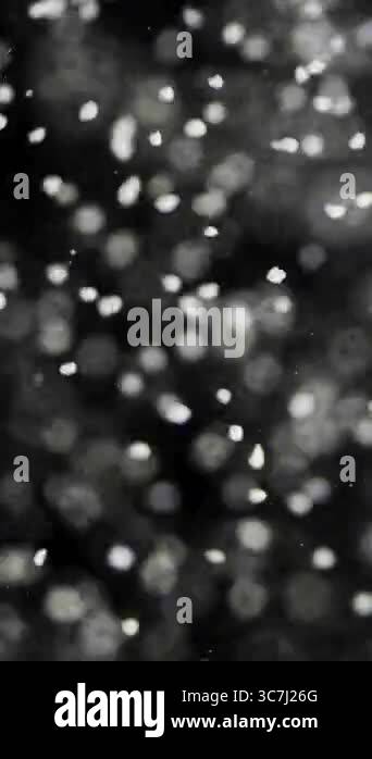 Falling snow on black background in motion. small snowflakes, falling ...