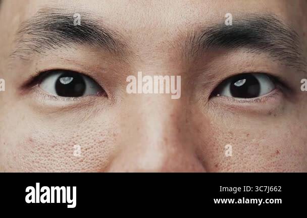 Young Asian Man Looking at Camera with Staring Eyes in Close-up Shot ...
