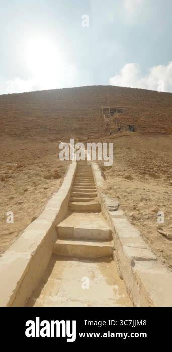 Stone steps lead towards the entrance of the red pyramid, located at the dahshur necropolis ...