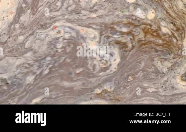 Swirling patterns of muddy water reveal intricate designs and textures ...