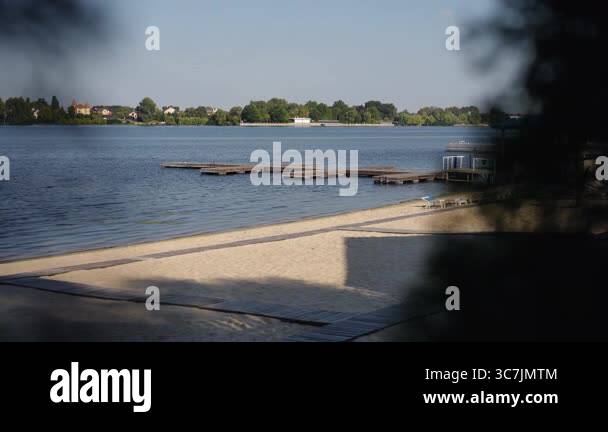 A serene and peaceful lakeside scene showcasing beautiful docks, calm ...
