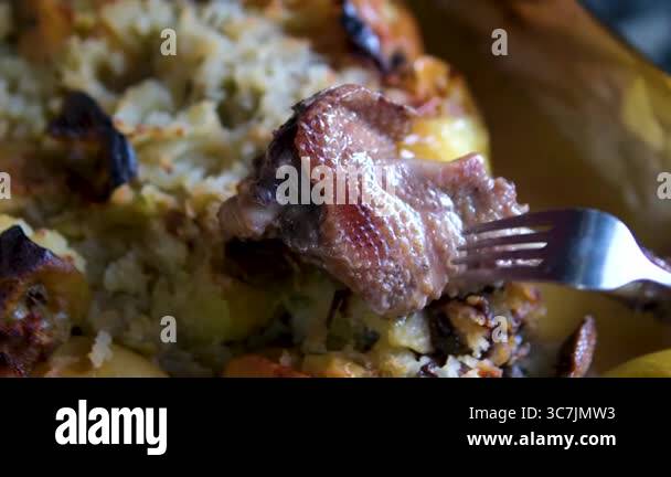 Cook sprinkles paprika on duck or goose stuffed with apples and lemon ...