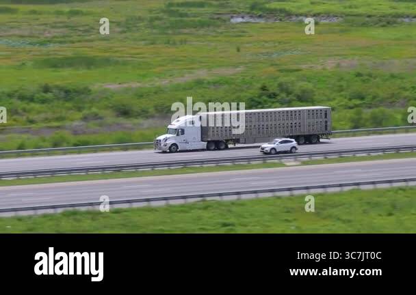 Interstate goods hauling in USA. Cargo tractor-trailer driving on ...