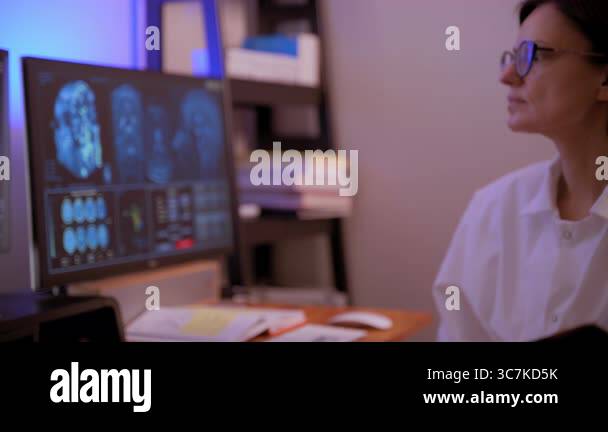 The doctor is analyzing a patients MRI scan to diagnose brain ...