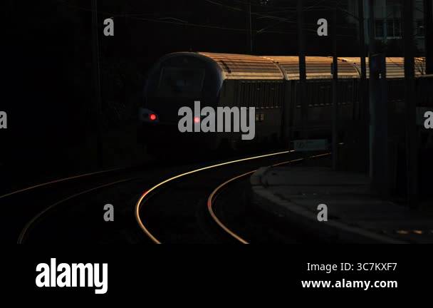Train moving on the rails at the station at night Stock Video Footage ...