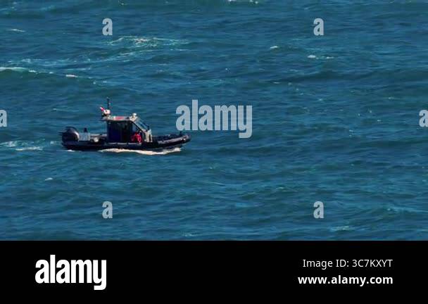 Nice, France - March 17, 2025: Small boat moving on the blue sea in ...