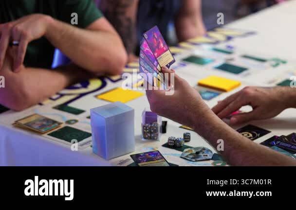 Cannes, France- March 2, 2025: People playing board games at the ...