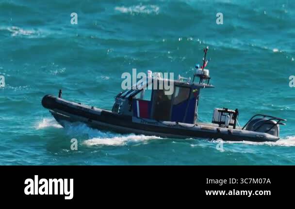 Nice, France - March 17, 2025: Small boat moving on the blue sea in ...