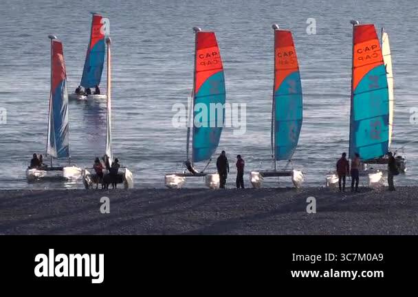 Cannes, France - March 19, 2025: Multiple, colourful, sailing ...