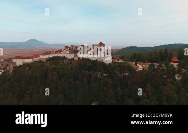 Aerial shots of a medieval castle in vibrant greenery, showcasing its ...