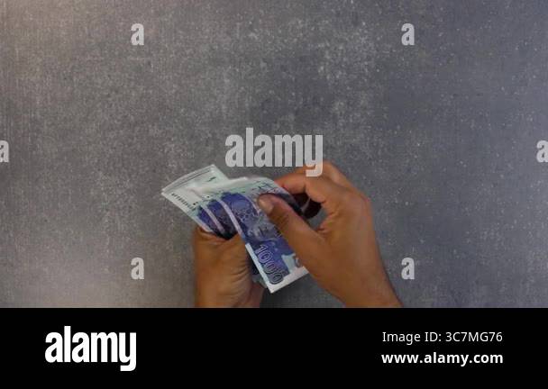 Man counting Pakistan 1000 rupees notes. Shopping concept Stock Video ...