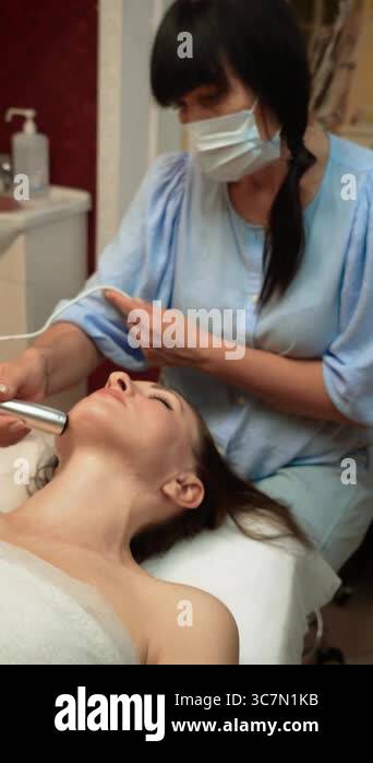 Vacuum Facial Massage performing on jawline, vertical orientation ...