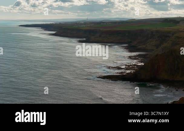 Beautiful rocky coastline with ocean waves stretching into distance ...