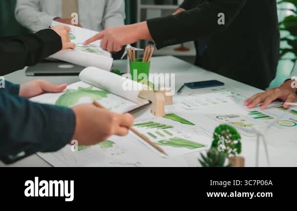 A diverse group of professionals engages in a collaborative meeting at ...