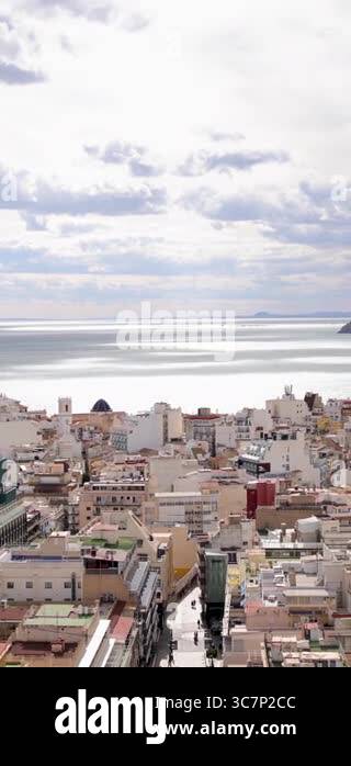 Portrait vertical aerial footage of the Spanish town of Benidorm in ...