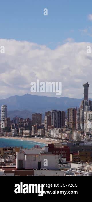 Portrait vertical time lapse footage over looking the town of Benidorm ...