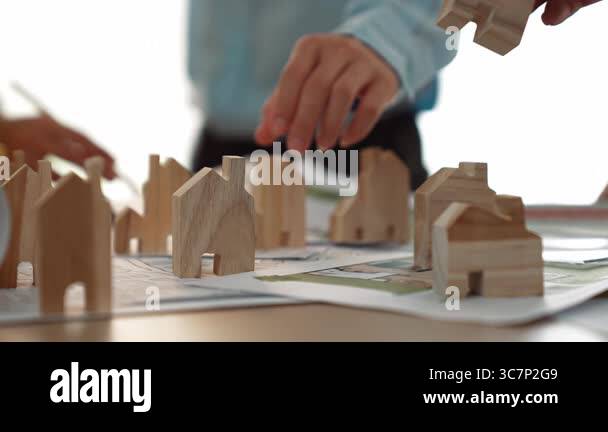 Architect and engineer discuss about building blueprint on table with ...