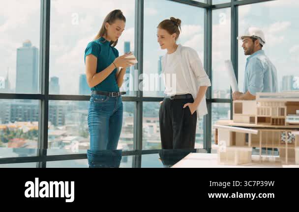 Skilled architect engineer team discuss about house construction while ...