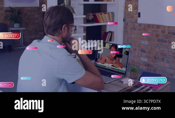 Animation of colorful data tags floating around man working on laptop ...