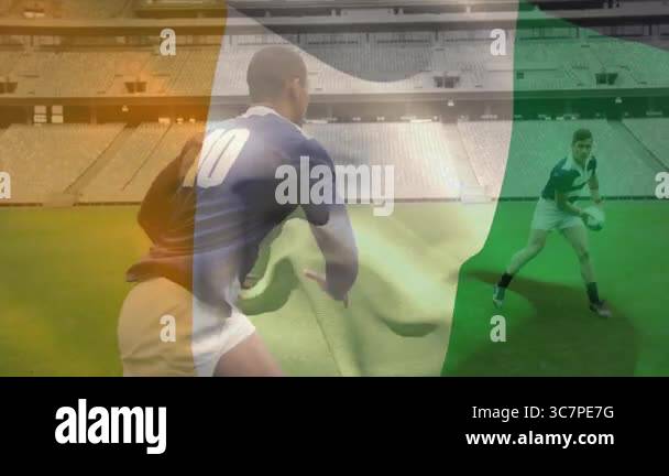 Passing ball on field, rugby players with animation of Irish flag ...