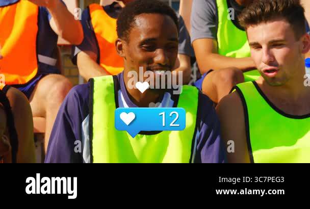 Soccer players on bench with social media likes animation overlay ...