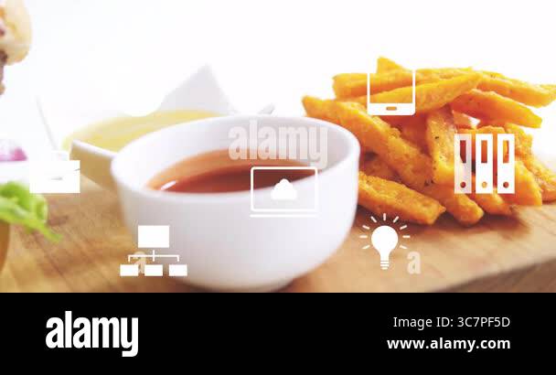 Animation of digital icons overlaying burger and fries in food concept ...