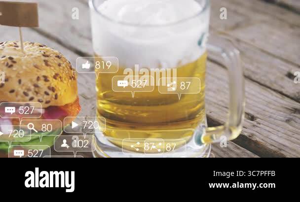 Burger and beer on table with animation of social media notification ...