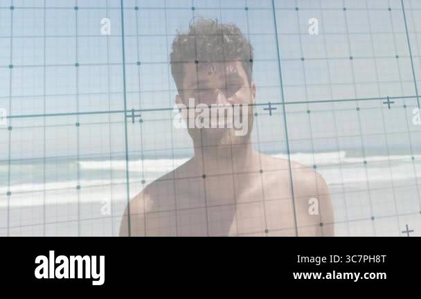 At beach, man smiling with animation of graph overlay showing data ...