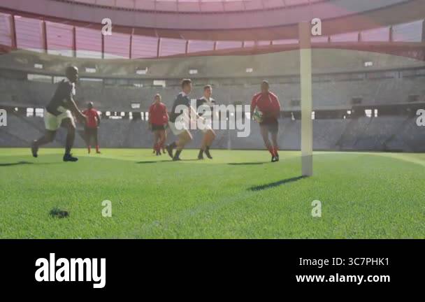 Diving to score try, rugby player in red jersey in stadium animation ...