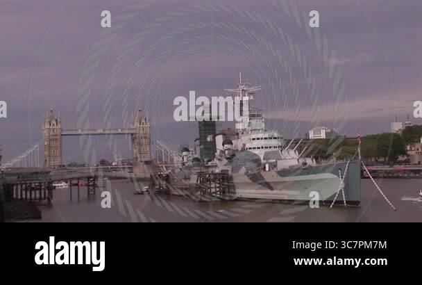 Docked battleship on river with Tower Bridge and animation overlay ...