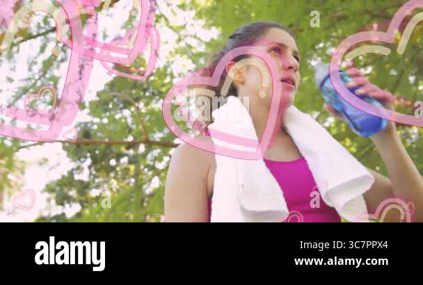 Drinking water outdoors, woman with pink heart animation overlay ...