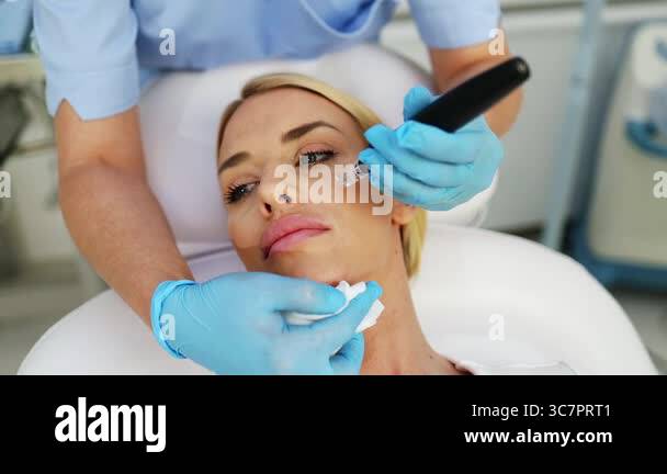 Young woman receiving hydra facial treatment for exfoliation ...