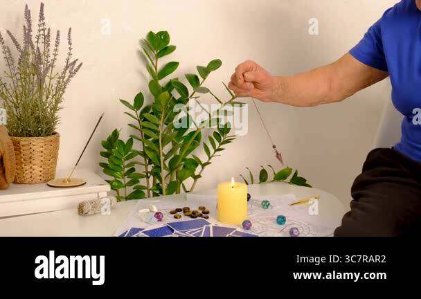 Pendulum fortune telling and astrology. Selective focus. people Stock ...