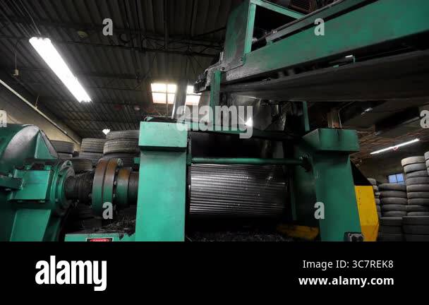 Process of Crushed tires processed in a recycling plant, showcasing ...