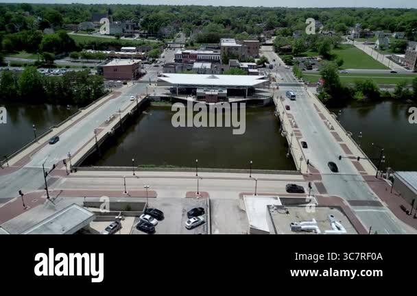 The aerial view of a Elgin town divided by Fox river, with two bridges ...