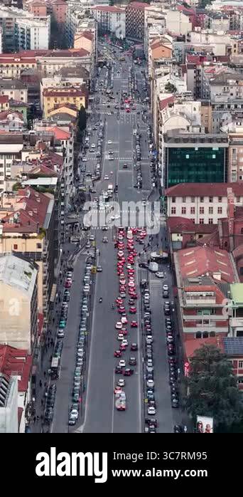 Aerial drone view of cars moving in traffic in Milan, Italy in daylight ...