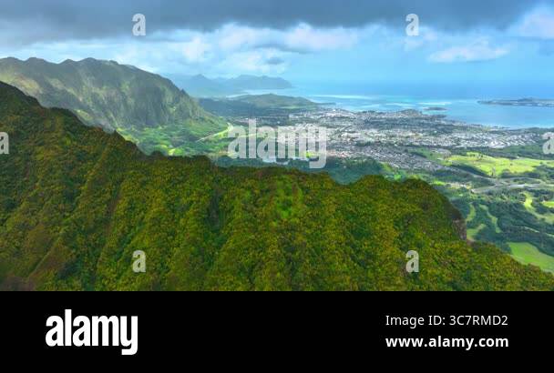 Rising over the stunning verdant mountain range. Revealing view of ...