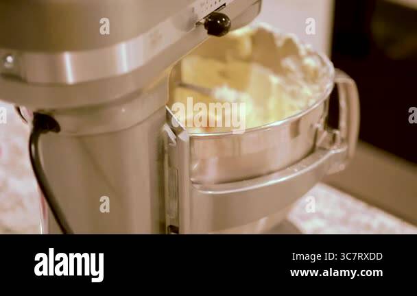 Stand mixer whips up creamy buttercream frosting to perfection, ready ...