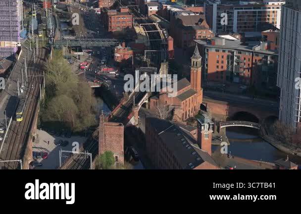 Aerial view of Manchester, UK, showing a clock tower, railway bridge ...