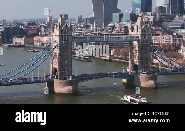 Aerial view of Tower Bridge over the River Thames with a gradual pan ...